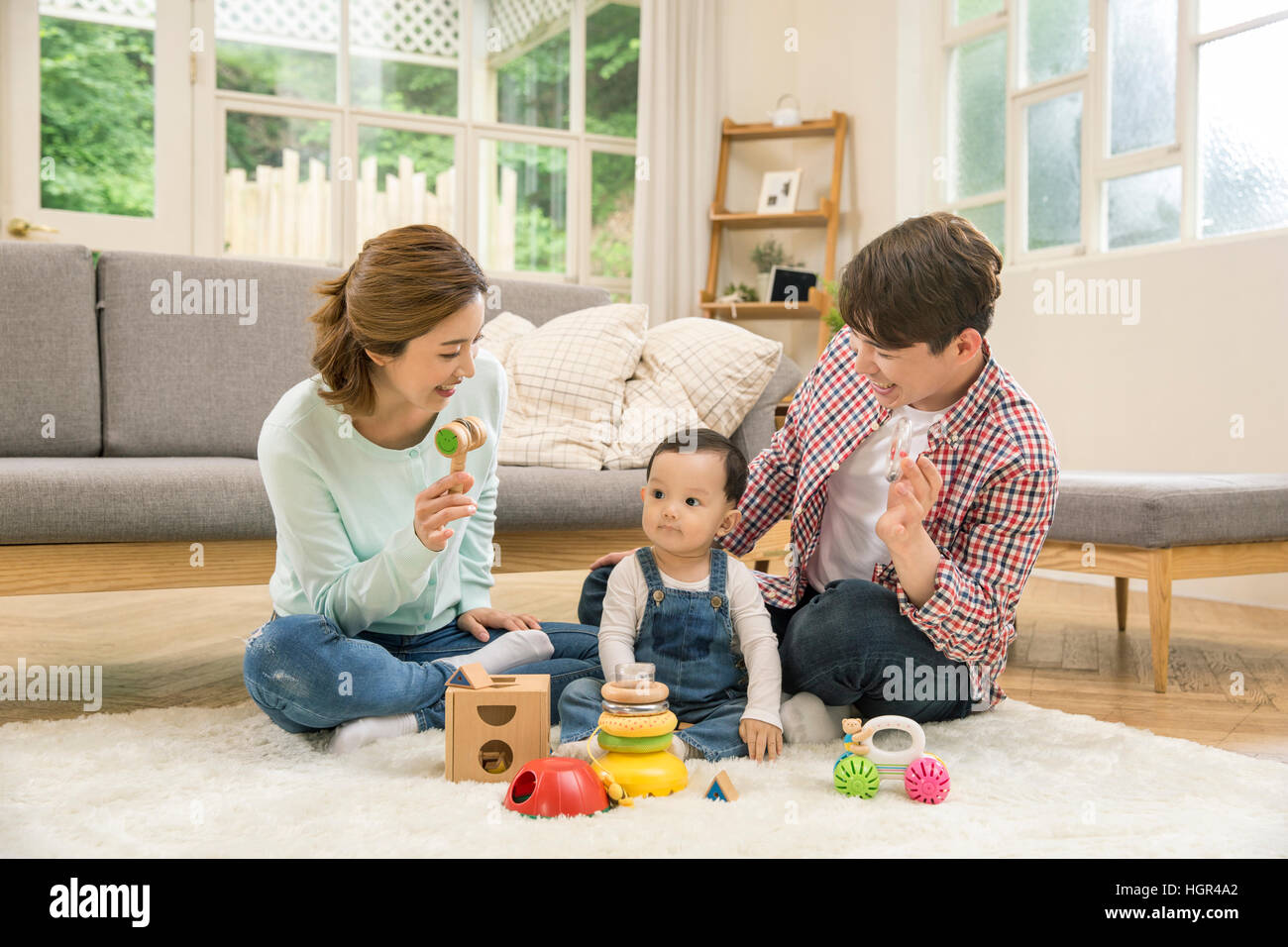 Harmonious family with baby Stock Photo - Alamy