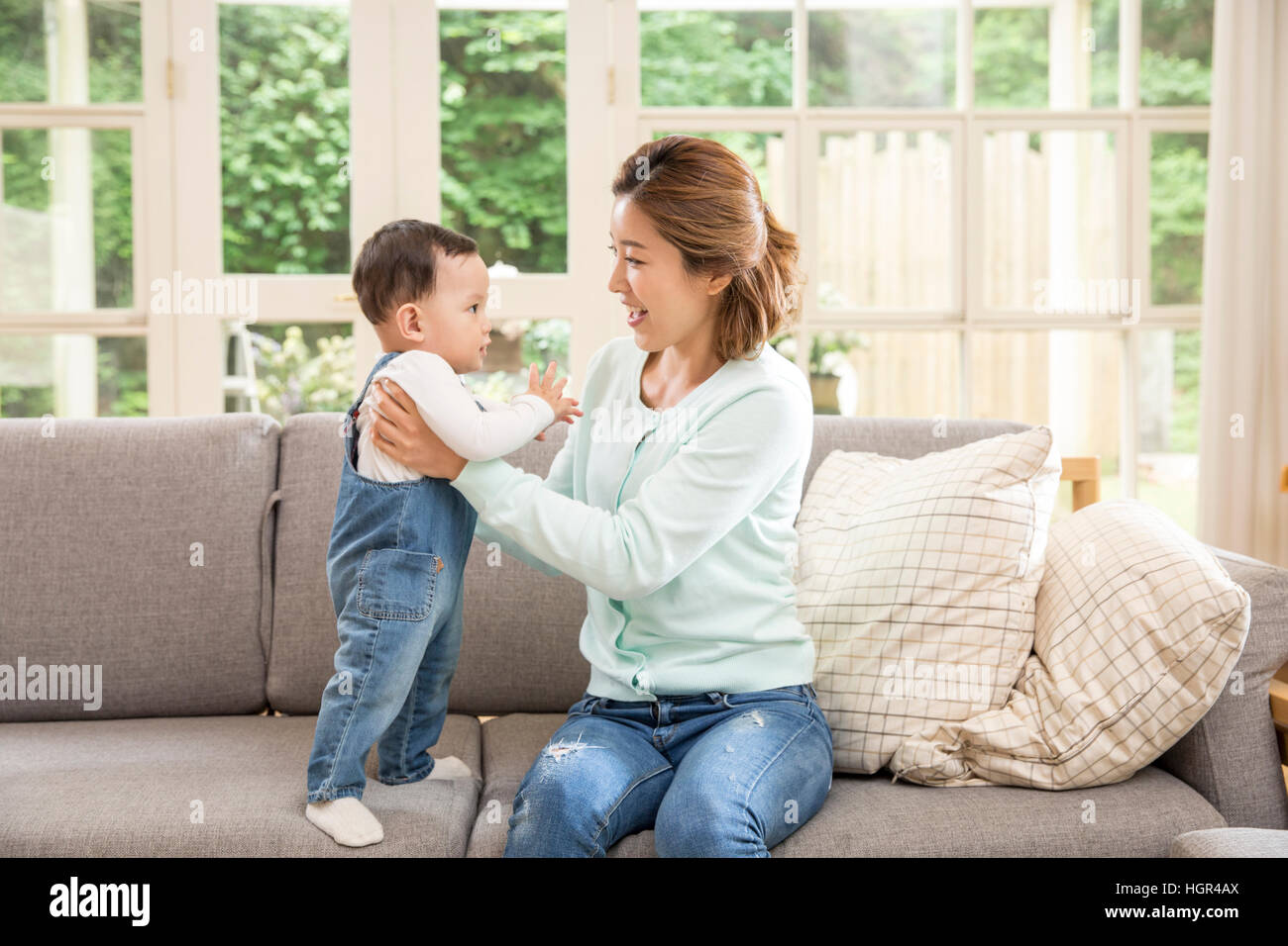 Loving mother baby standing hi-res stock photography and images - Alamy