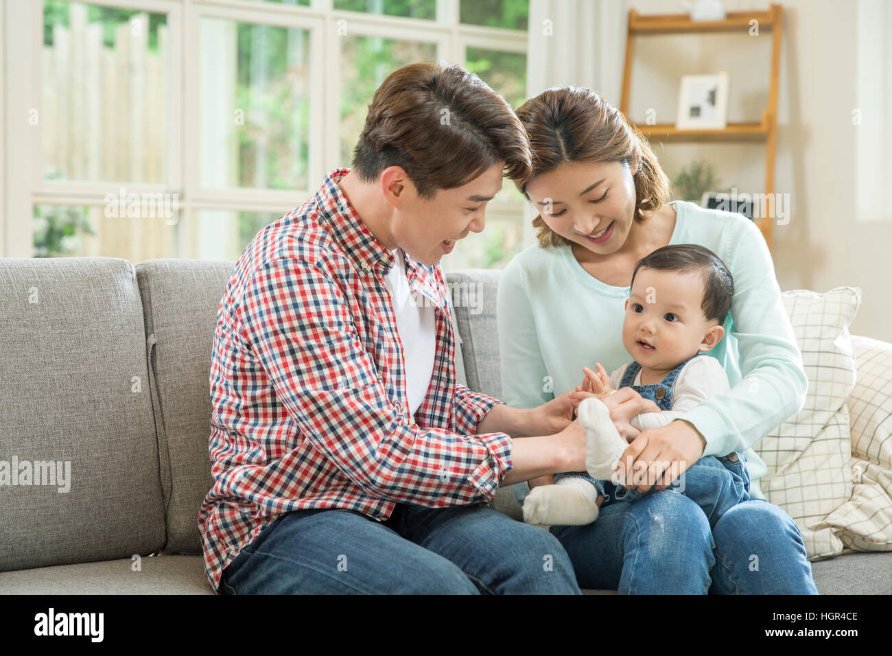 Harmonious family with baby Stock Photo - Alamy