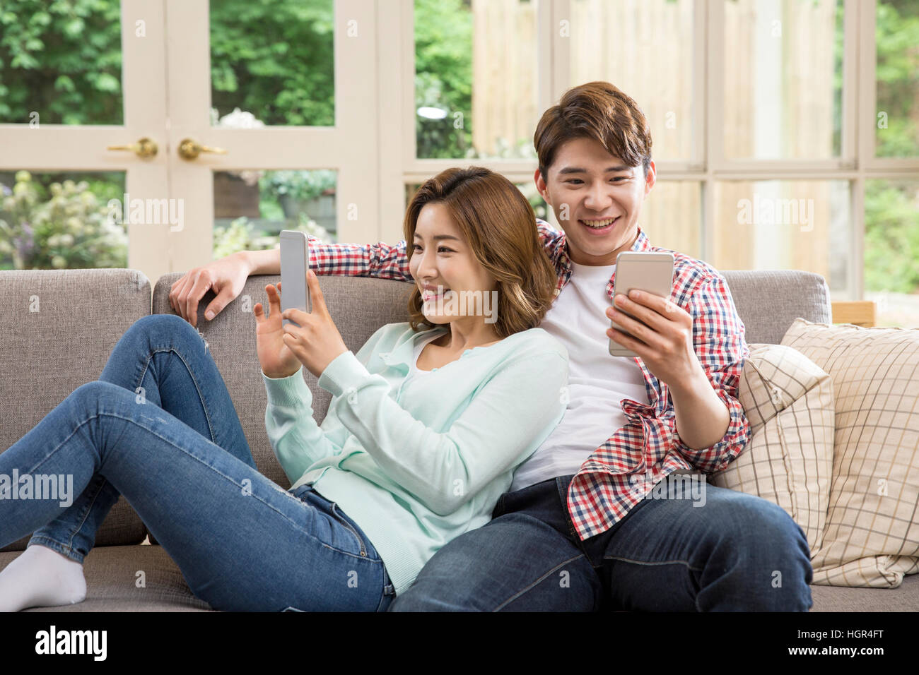 Young smiling couple resting Stock Photo - Alamy