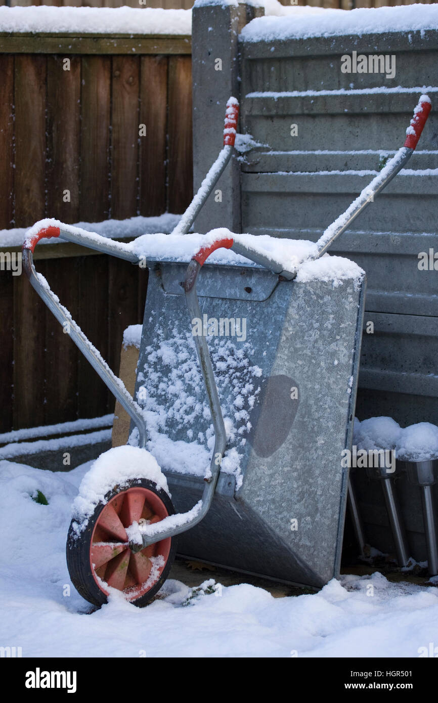 Wheelbarrow in the snow Stock Photo - Alamy