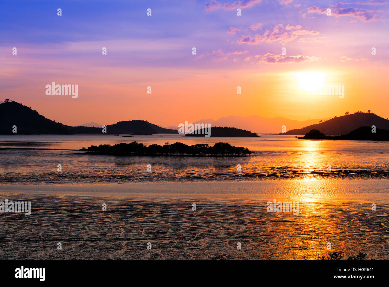 Nice sunset over sea and silhouette mountain twilight time wide shot ...