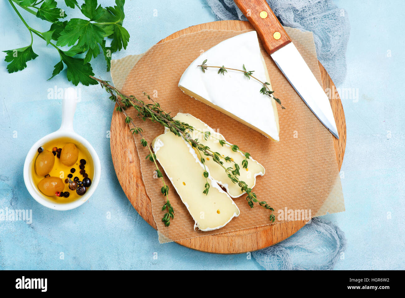 cheese on board and on a table Stock Photo - Alamy