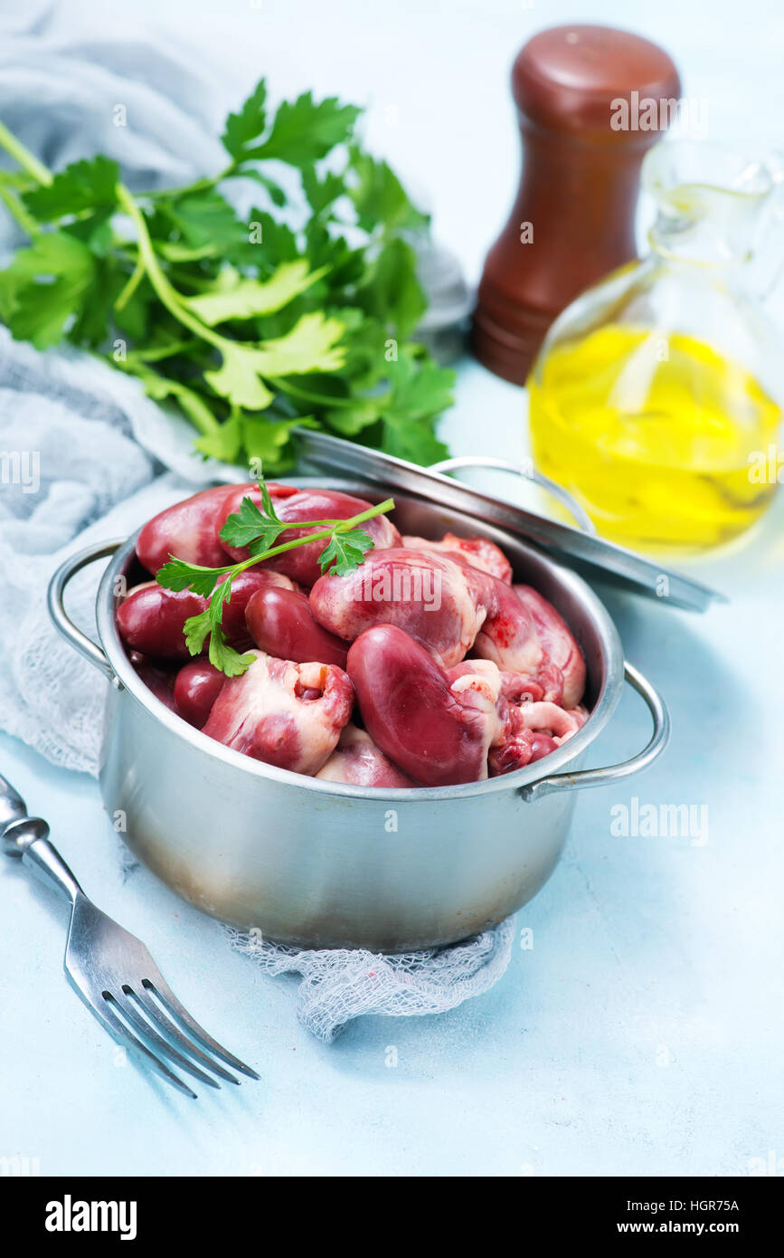 raw hearts in bowl and on a table Stock Photo - Alamy