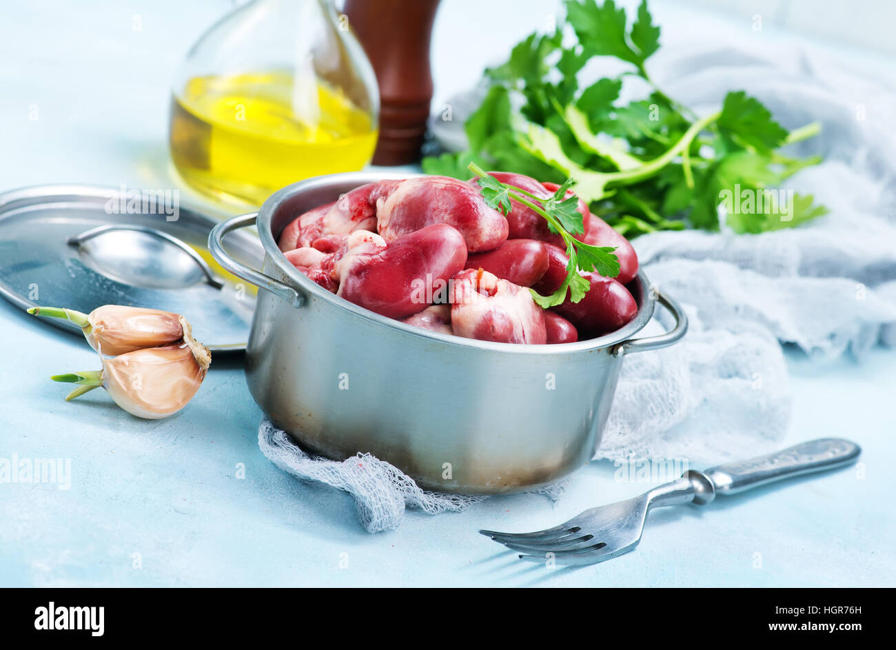 raw hearts in bowl and on a table Stock Photo - Alamy