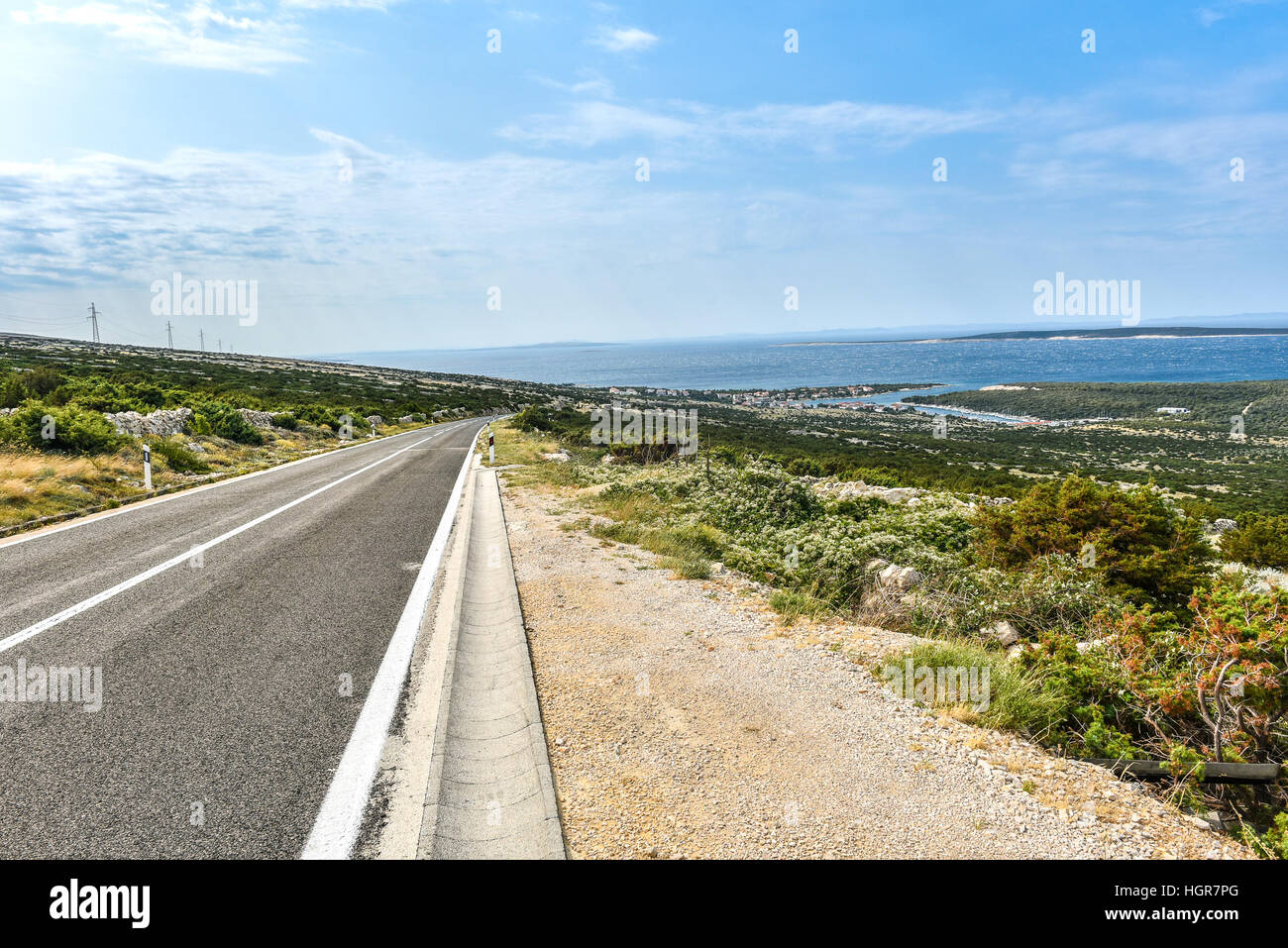 Open road leading to the sea. Vacation traveling on asphalt road to the ...