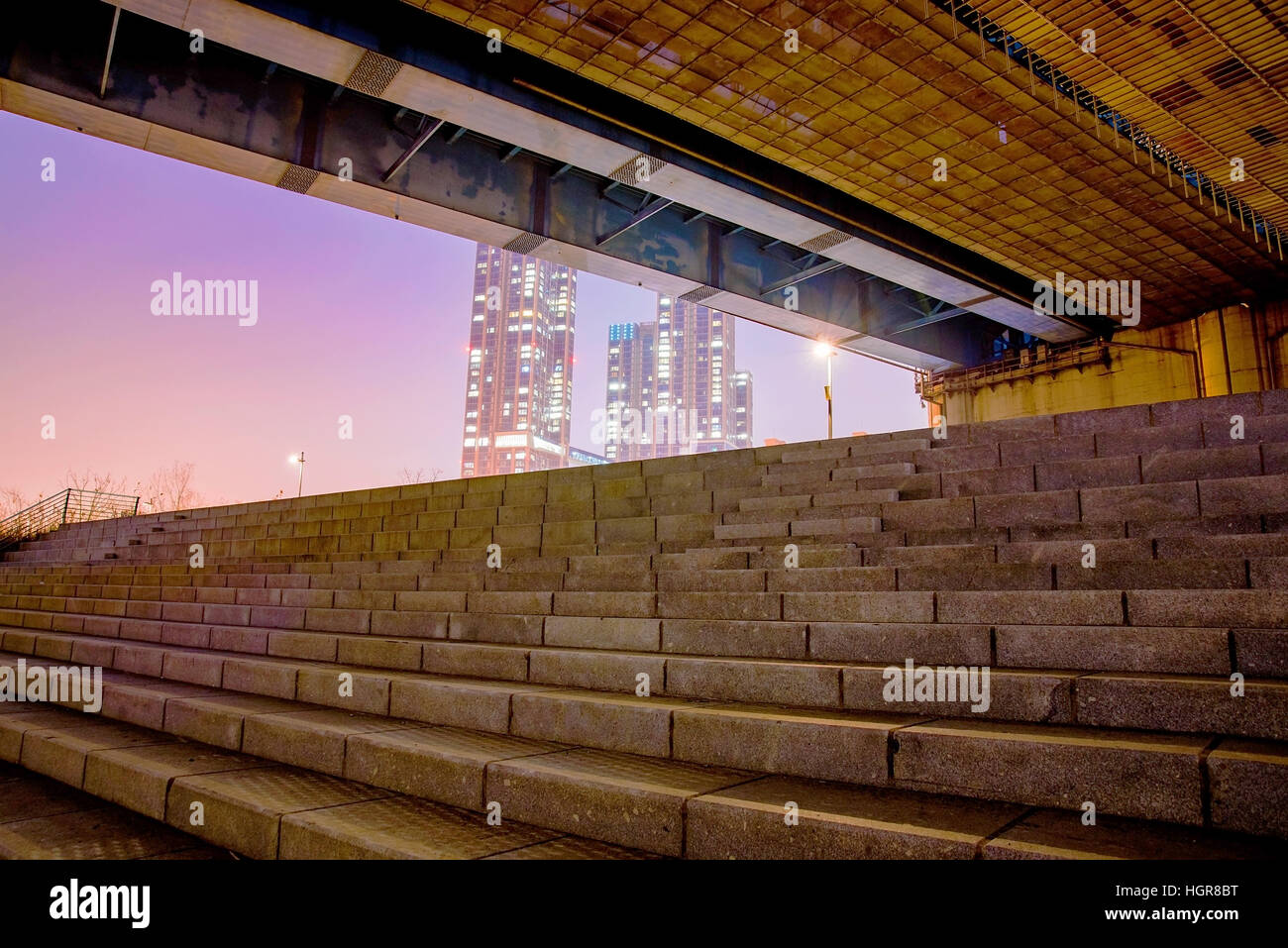 Cityscape under a bridge at night Stock Photo - Alamy