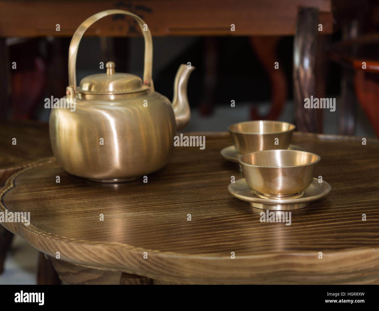 Traditional Asian Golden Teapot and Cups on Little Wooden Table Stock ...