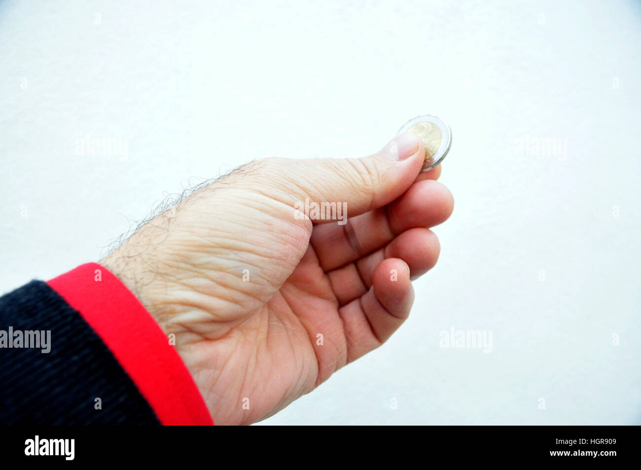 hand with coin Stock Photo - Alamy