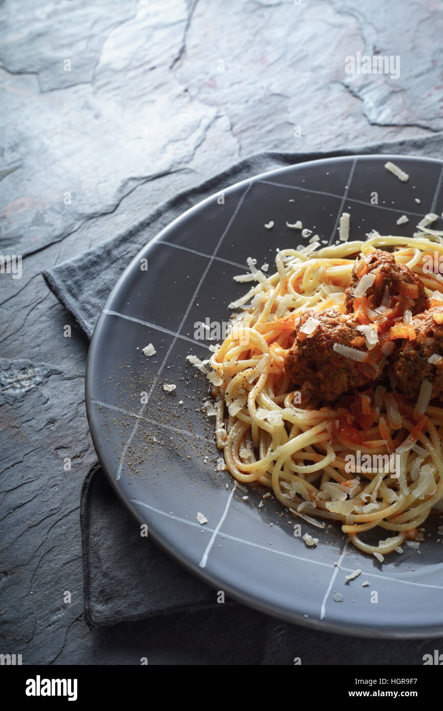 Spaghetti with meatball on the stone background vertical Stock Photo ...