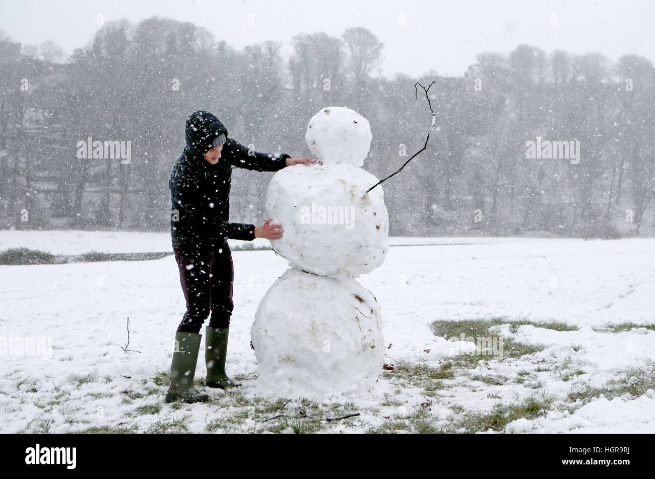 Charlie Boldison building a snowman in Stirling, as blizzard conditions ...
