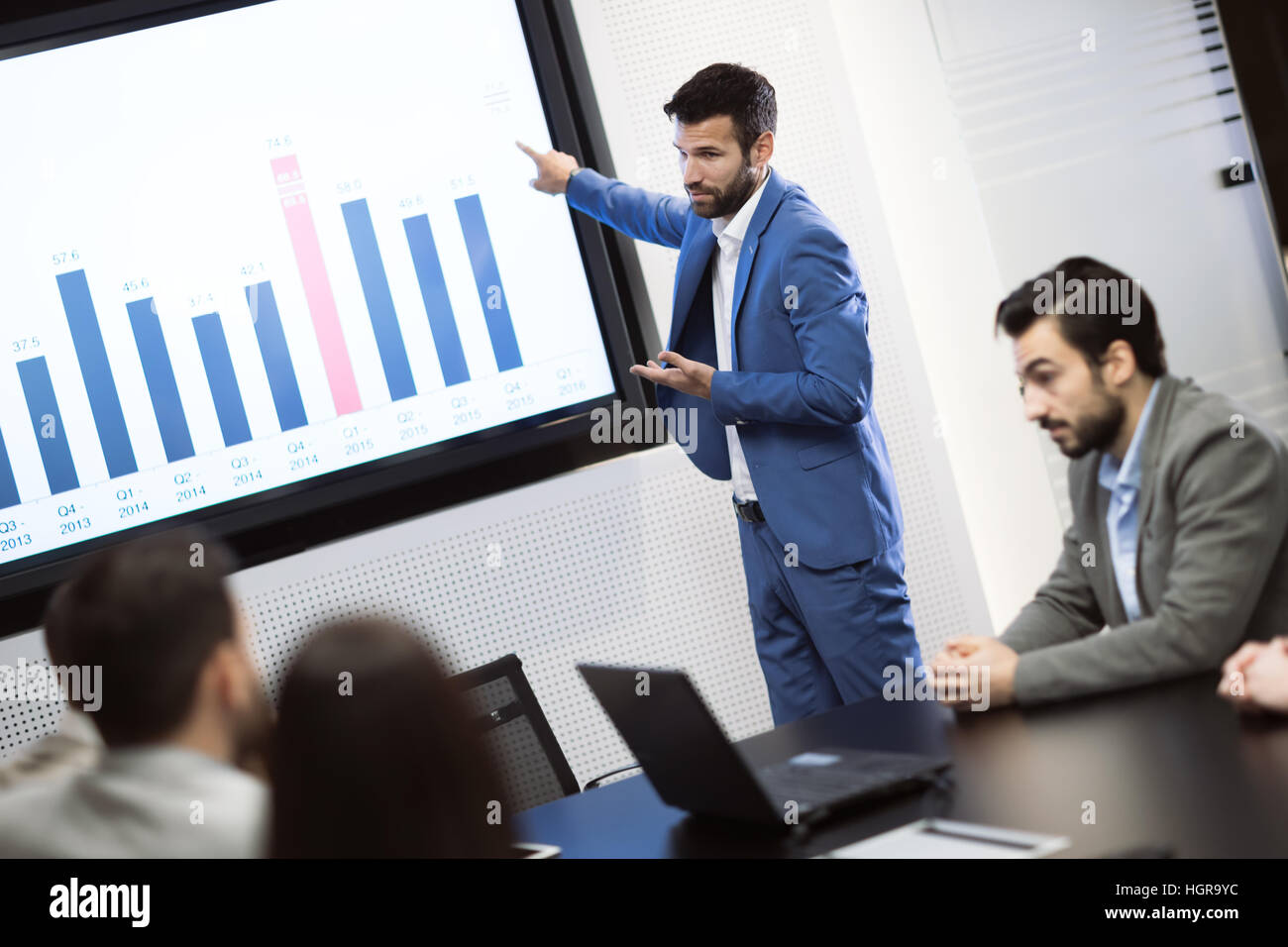 Business people analyzing data at meeting in office and doing ...