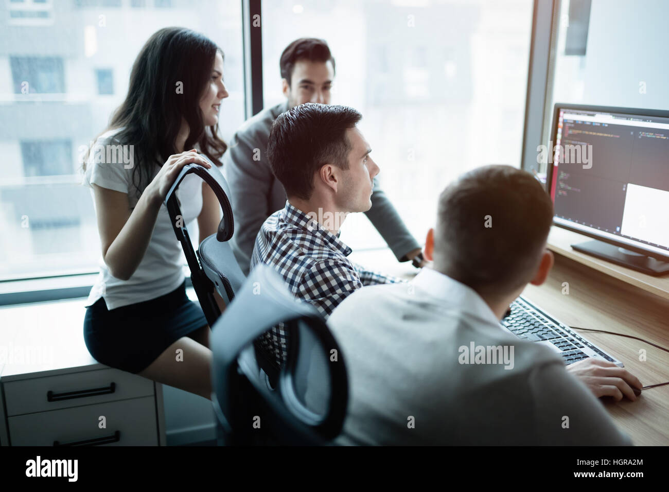 Group of business people and software developers working as a team in ...