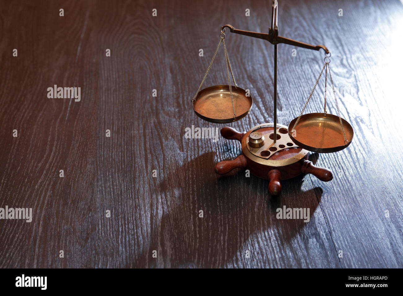 Old brass weight scales on dark wooden background with free space Stock ...