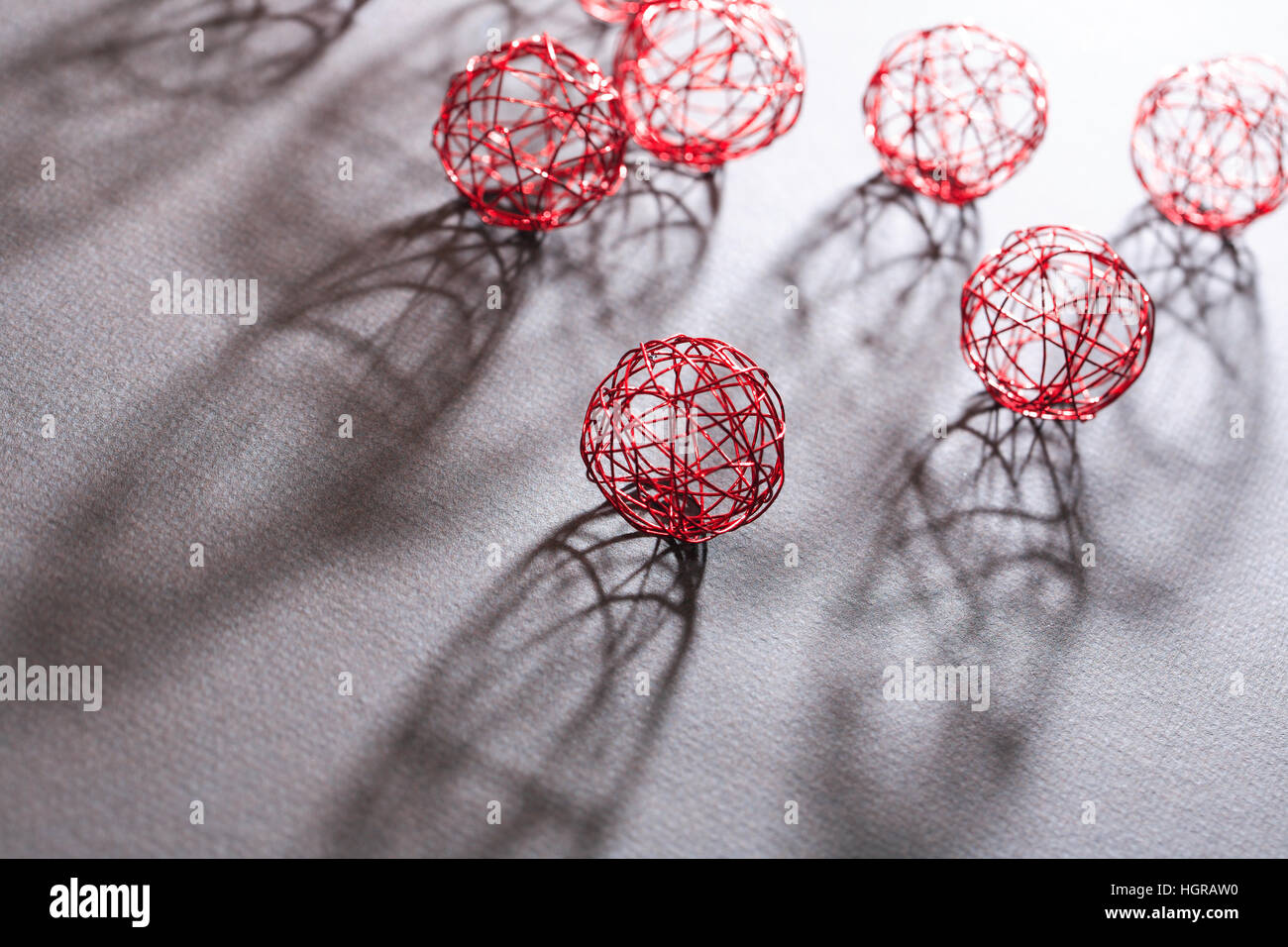 Set of balls made from red wire in a row with shadow Stock Photo - Alamy