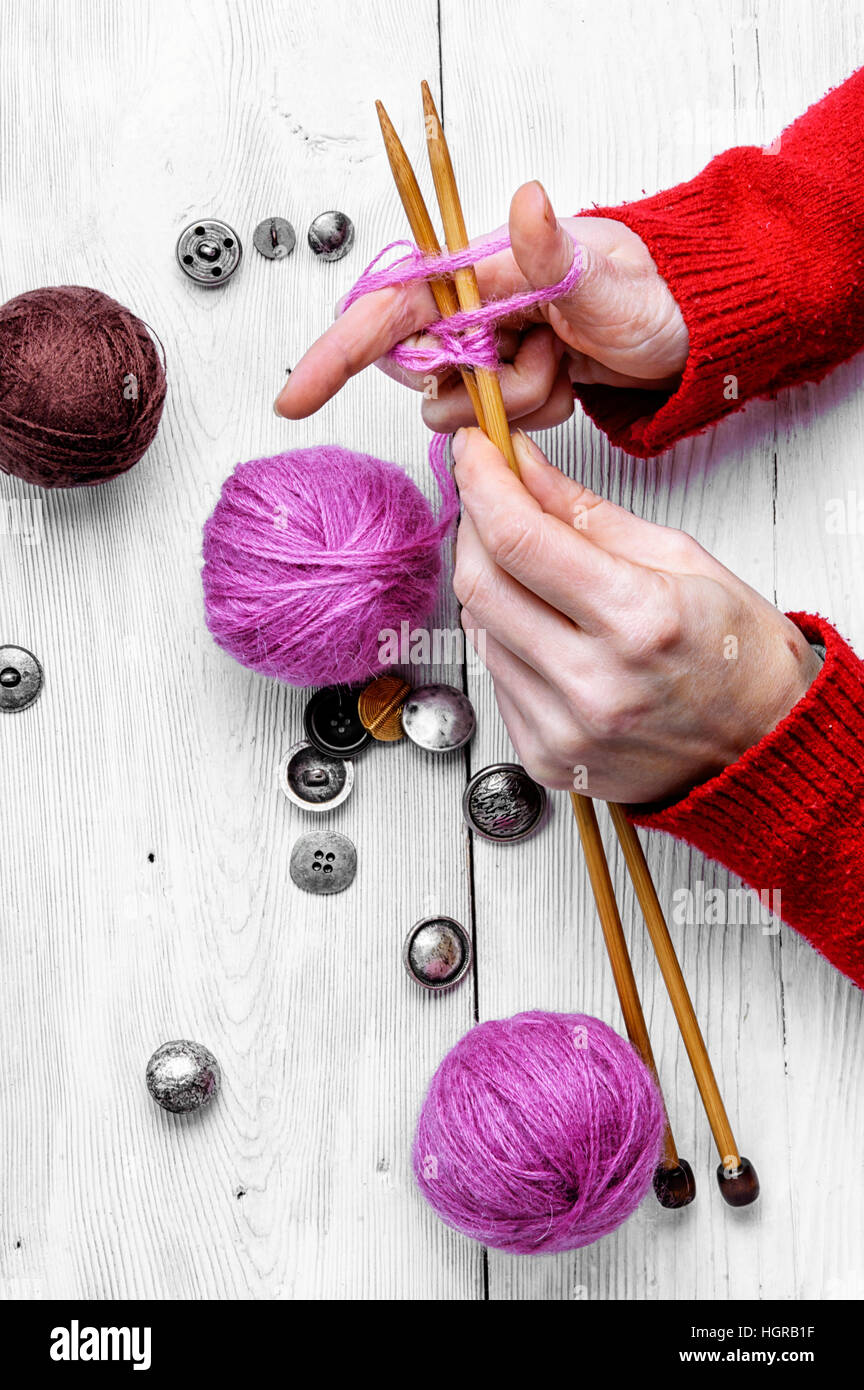 Female hands with knitting needles and balls of wool Stock Photo - Alamy