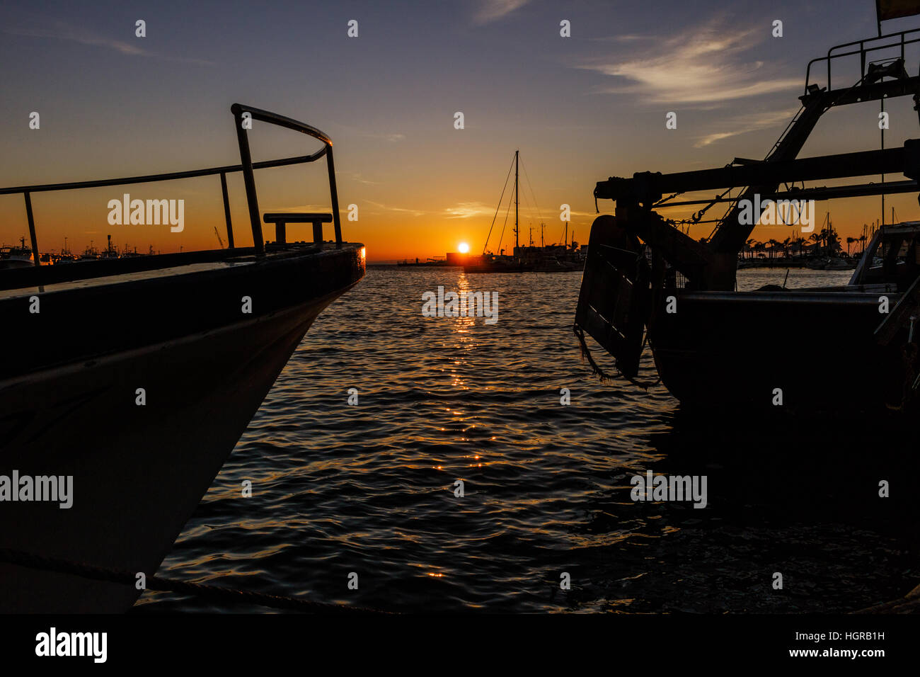 Sunset at harbour Stock Photo - Alamy