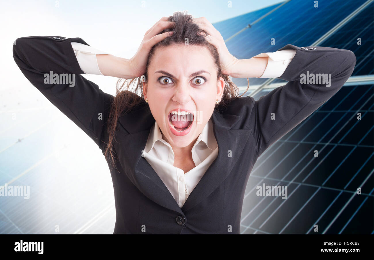 Mad or angry business woman screaming and having problem with solar ...