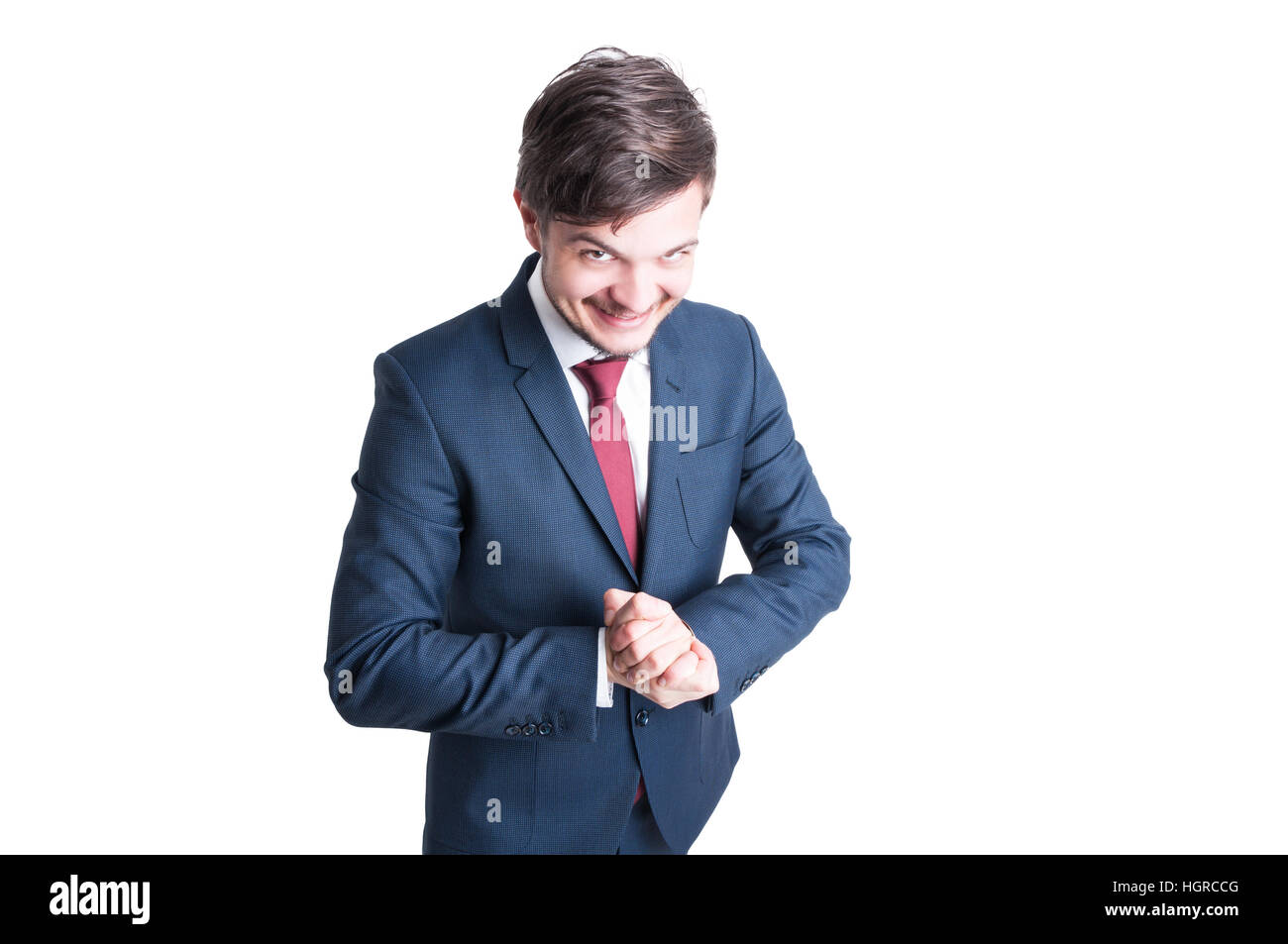 Sales man wearing making evil look and gesture like winning something ...