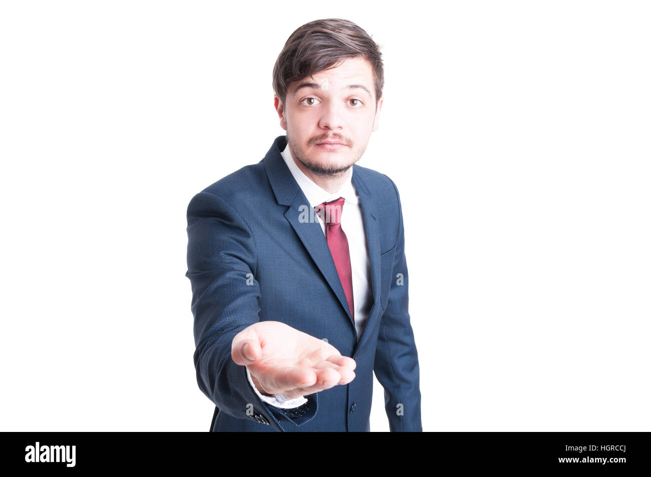 Sales man wearing suit making begging gesture with one hand isolated on ...