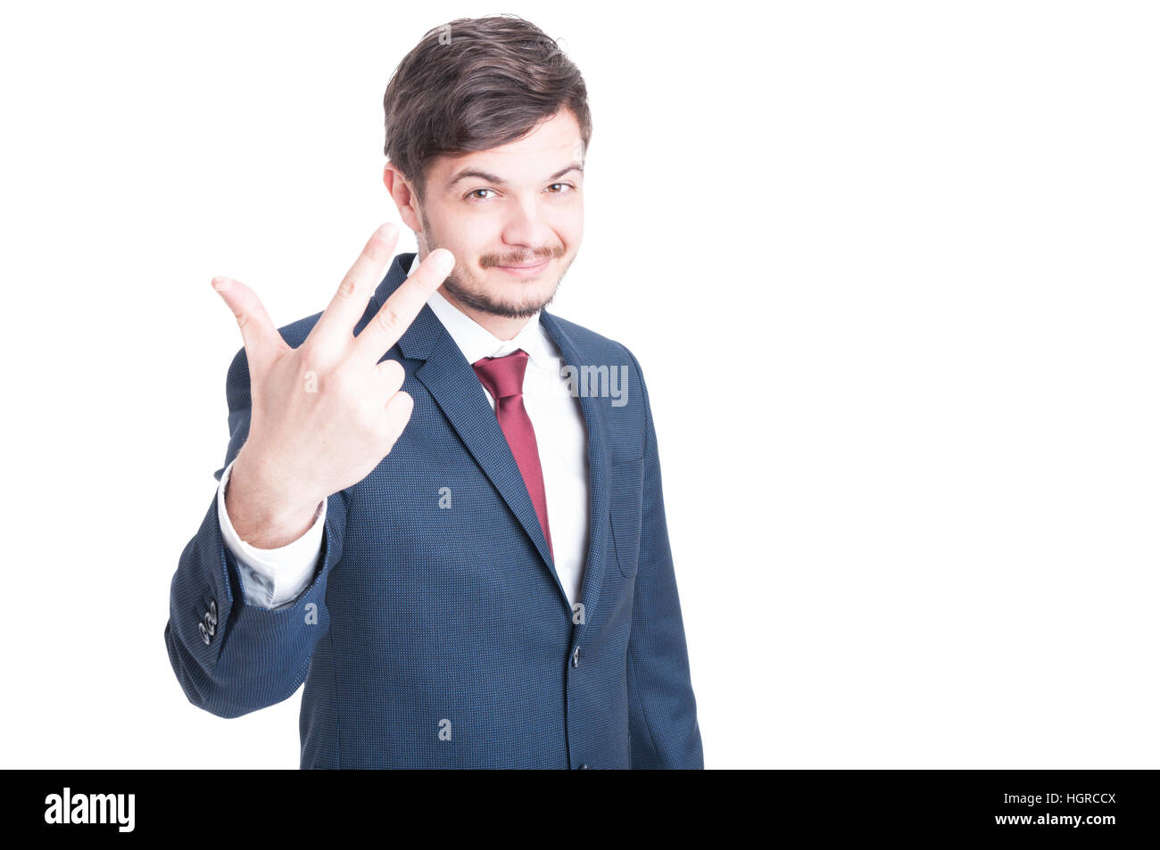 Smiling sales man showing three with one hand isolated on white ...