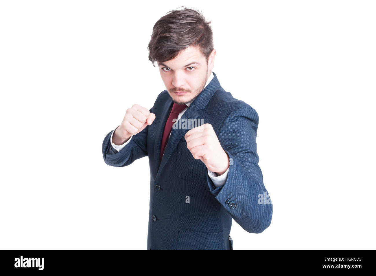 Sales man standing in fighting position wearing suit isolated on white ...