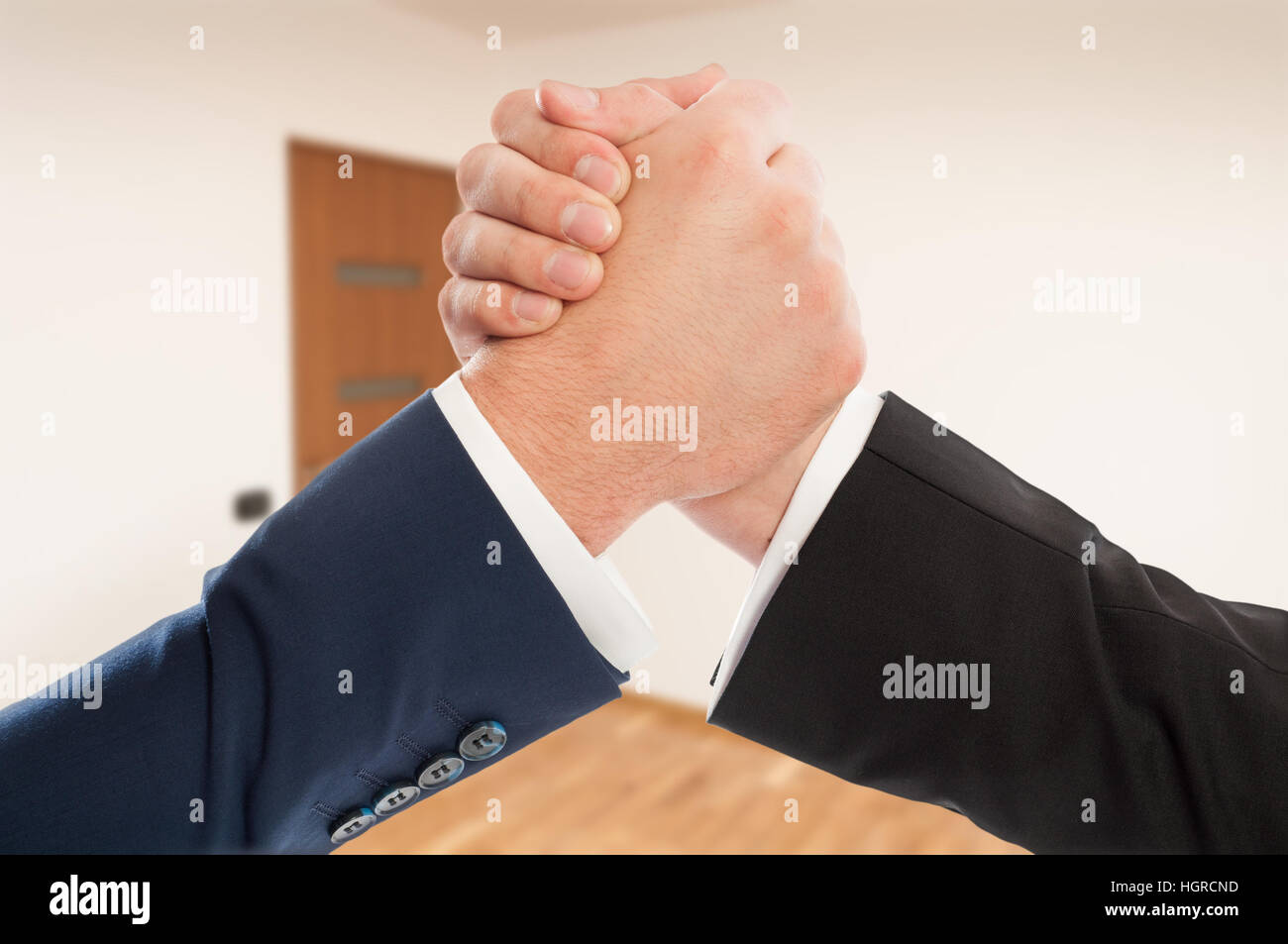 Hand shaking between two colleagues as teamwork or union concept in ...