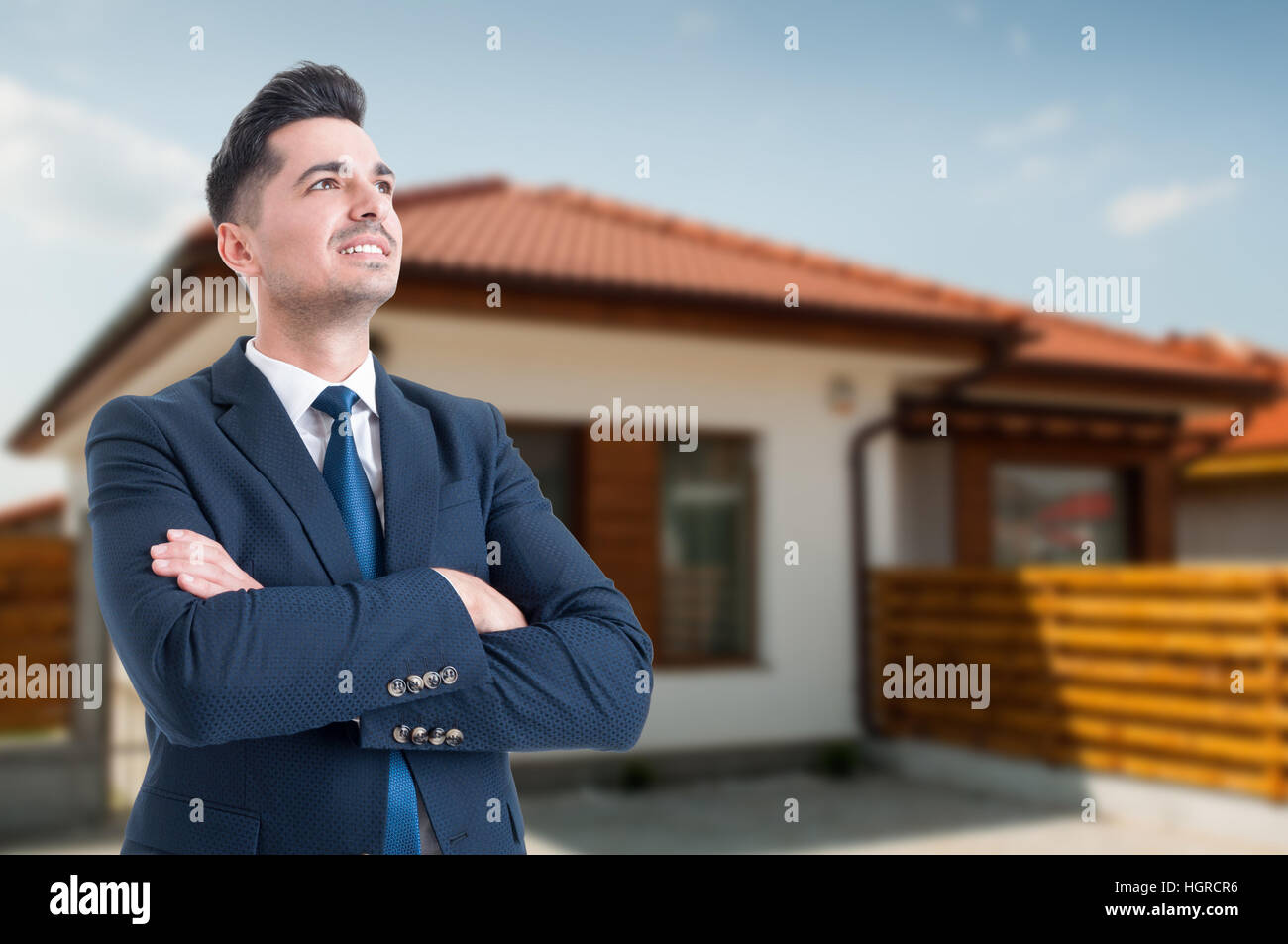 Happy estate agent folded hi-res stock photography and images - Alamy
