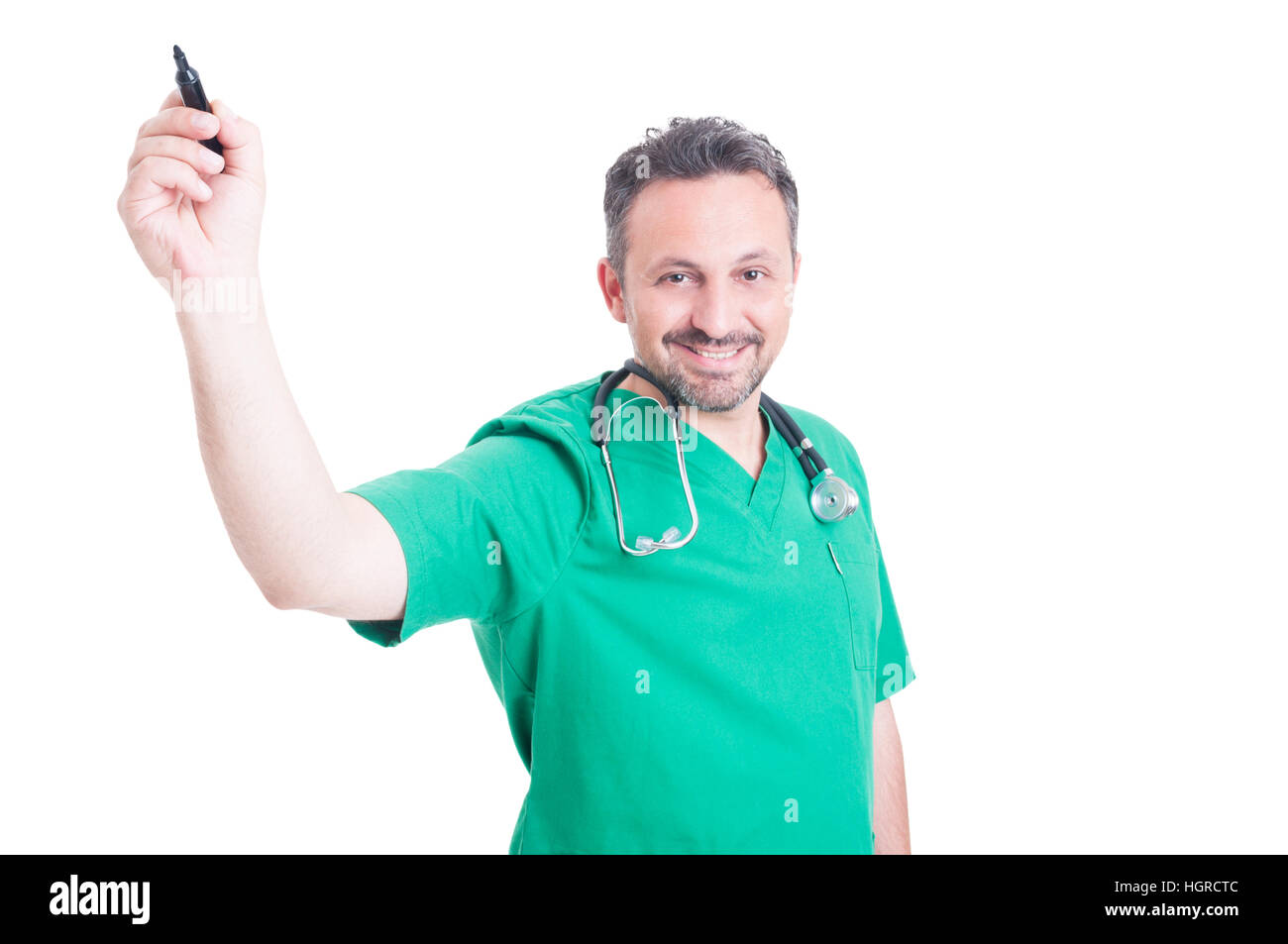 Young male medic or doctor writing on blank glass or virtual screen ...