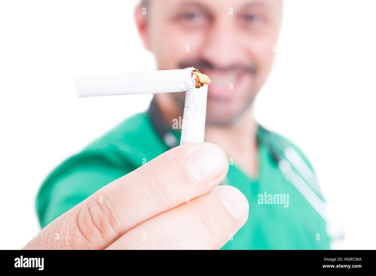 Close-up doctor hand showing ripped cigarette as concept for stop ...