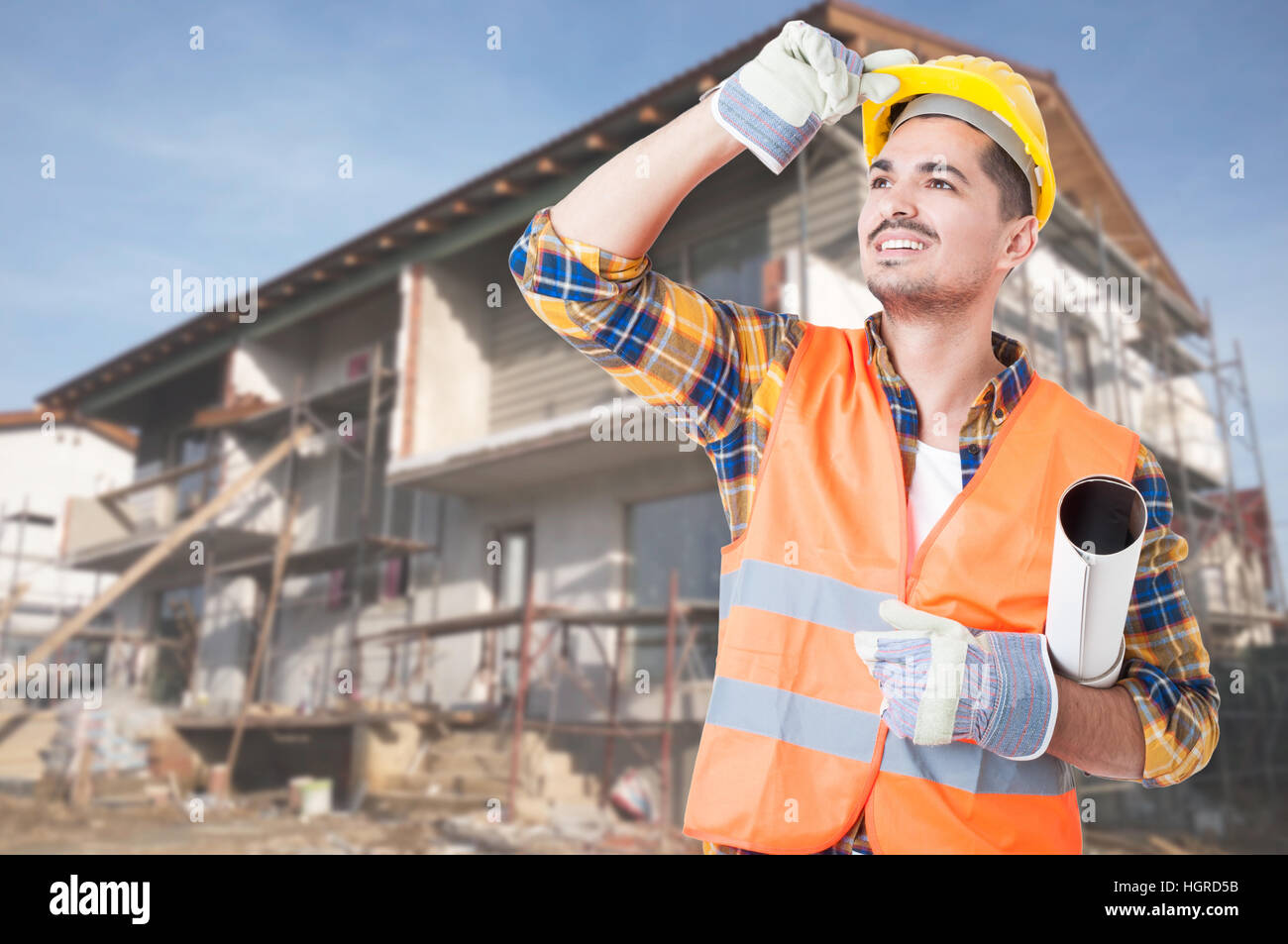 Home inspector checking the building progress as outdoor construction ...