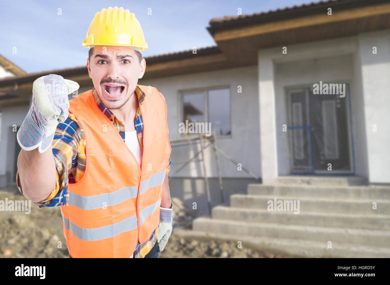 Angry builder having problems and screaming at somebody outside the ...
