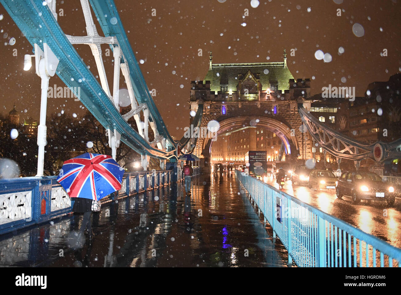 Falling snow on Tower Bridge in London, as blizzard conditions are set ...