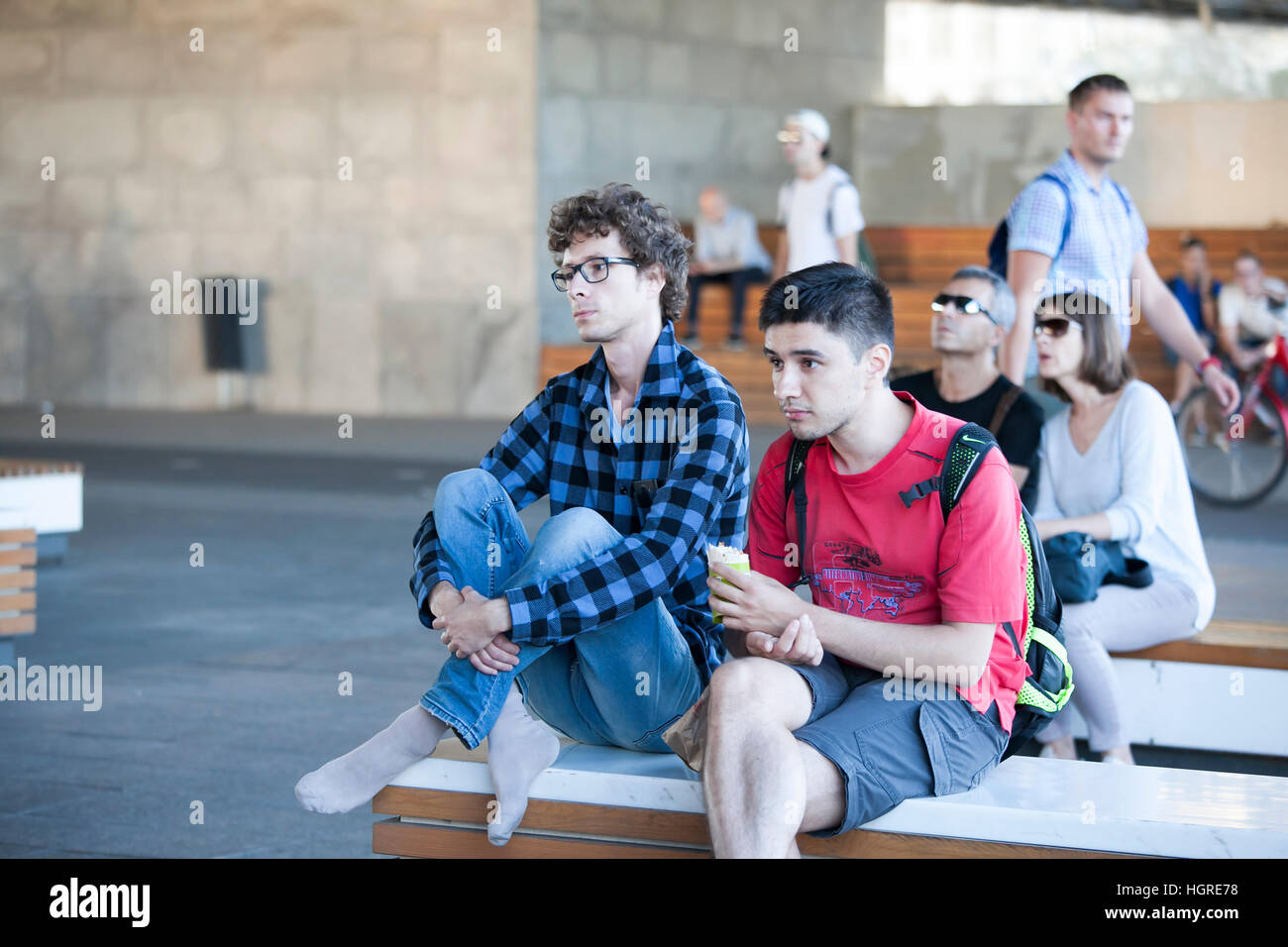 Moscow, RUSSIA - June 23, 2016: Two young men in sunglasses sitting on ...
