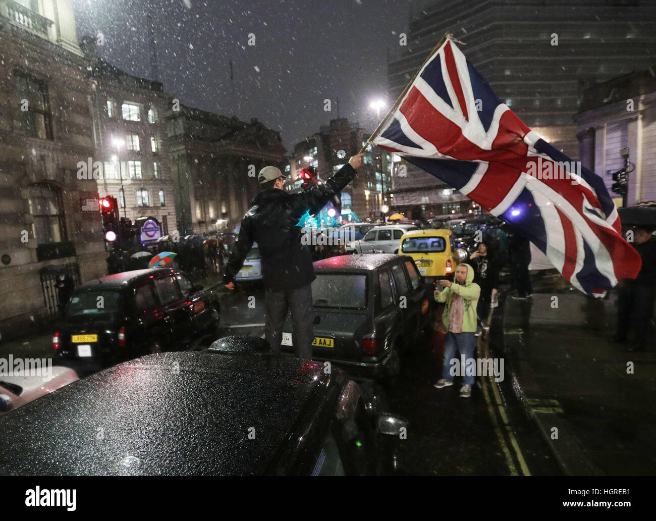 Black cab taxi drivers protest by bringing traffic to a standstill at ...