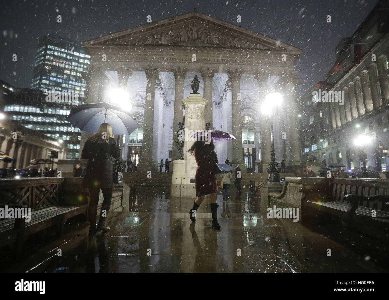 People during a snow flurry at Bank, City of London, as blizzard ...