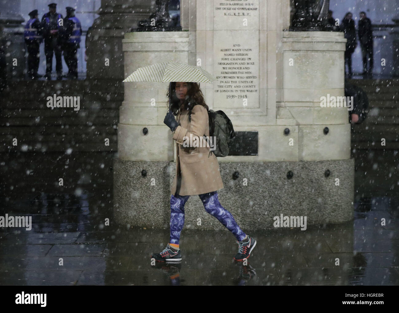 People during a snow flurry at Bank, City of London, as blizzard ...