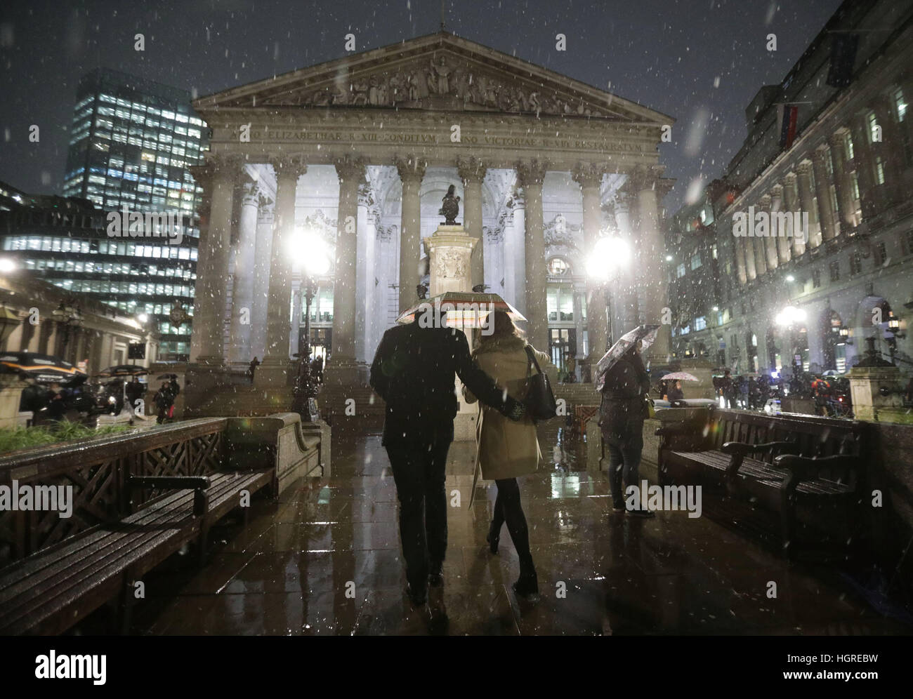 People during a snow flurry at Bank, City of London, as blizzard ...