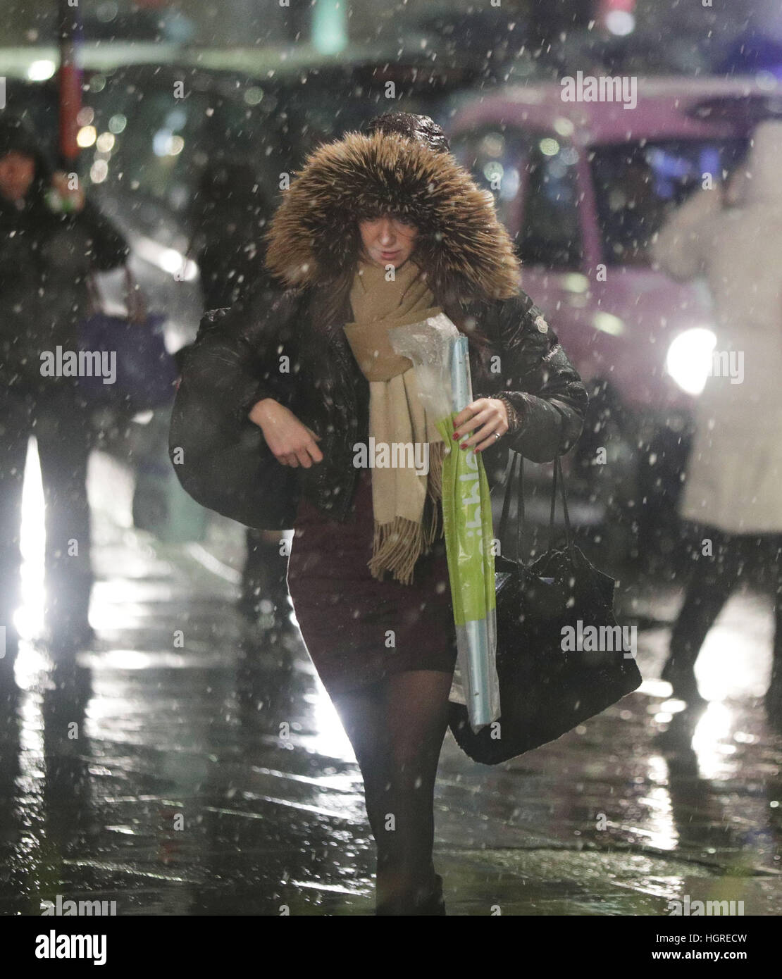 People during a snow flurry at Bank, City of London, as blizzard ...