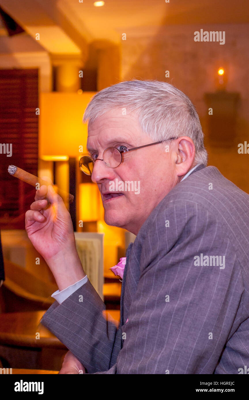 Artist David Hockney smoking a cigar, in a Brighton restaurant, during ...