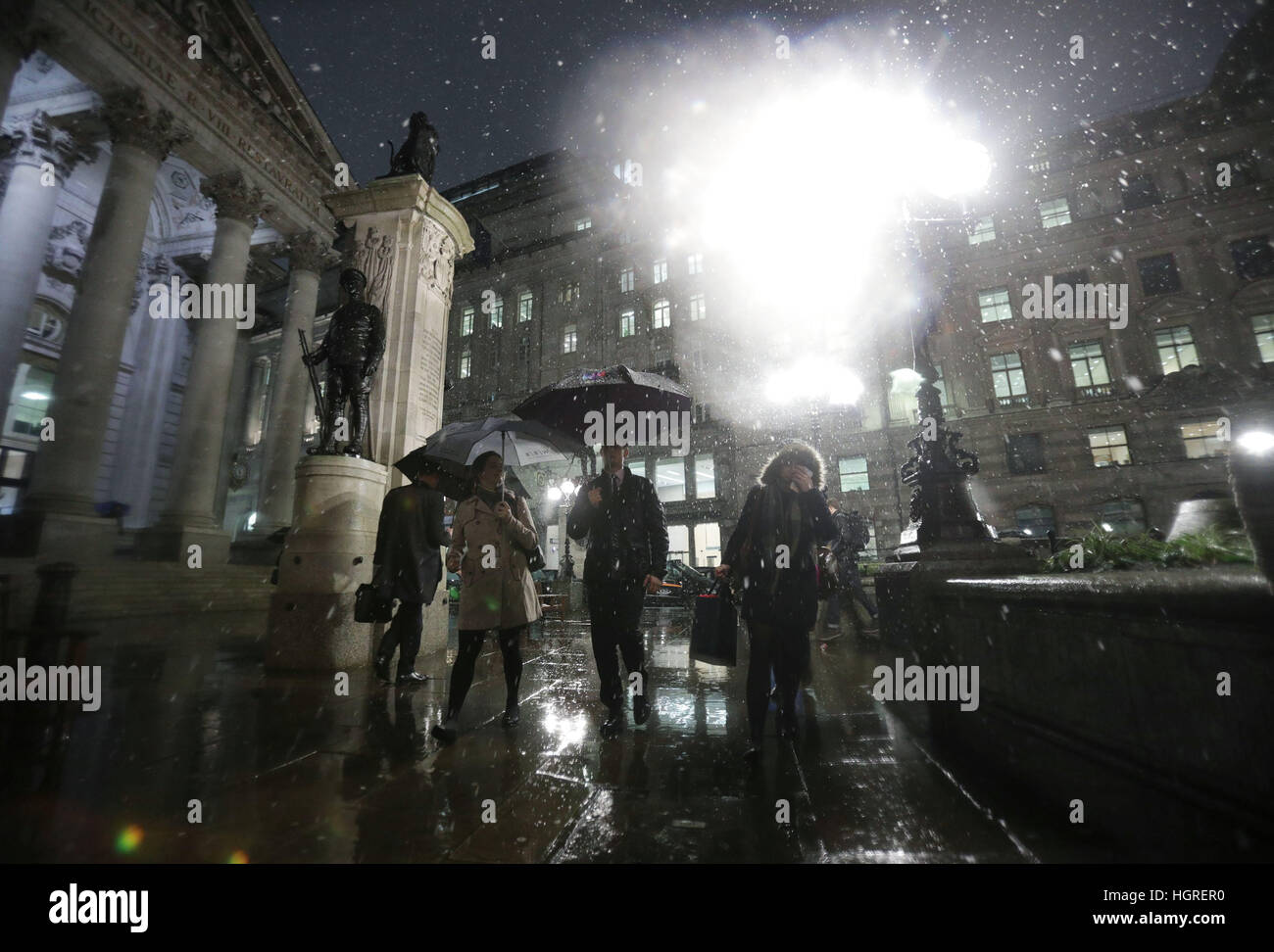 People during a snow flurry at Bank, City of London, as blizzard ...