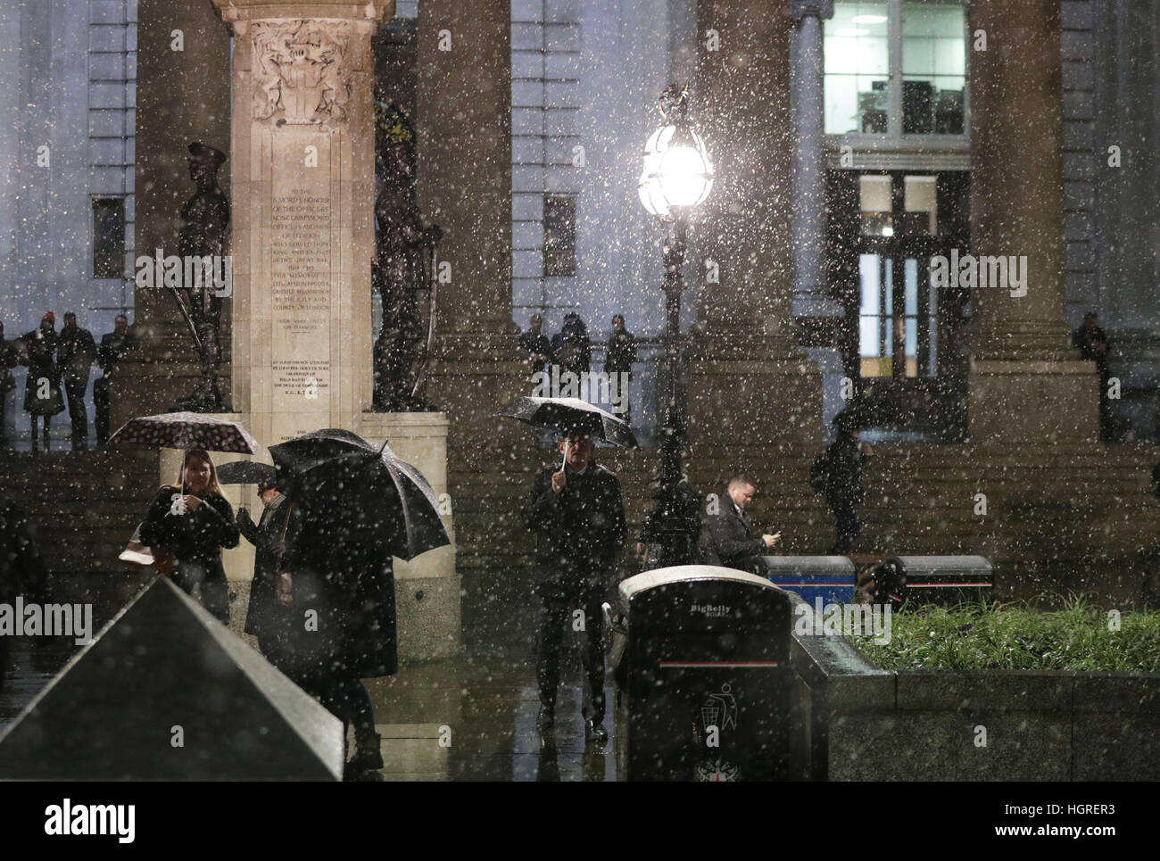 People during a snow flurry at Bank, City of London, as blizzard ...