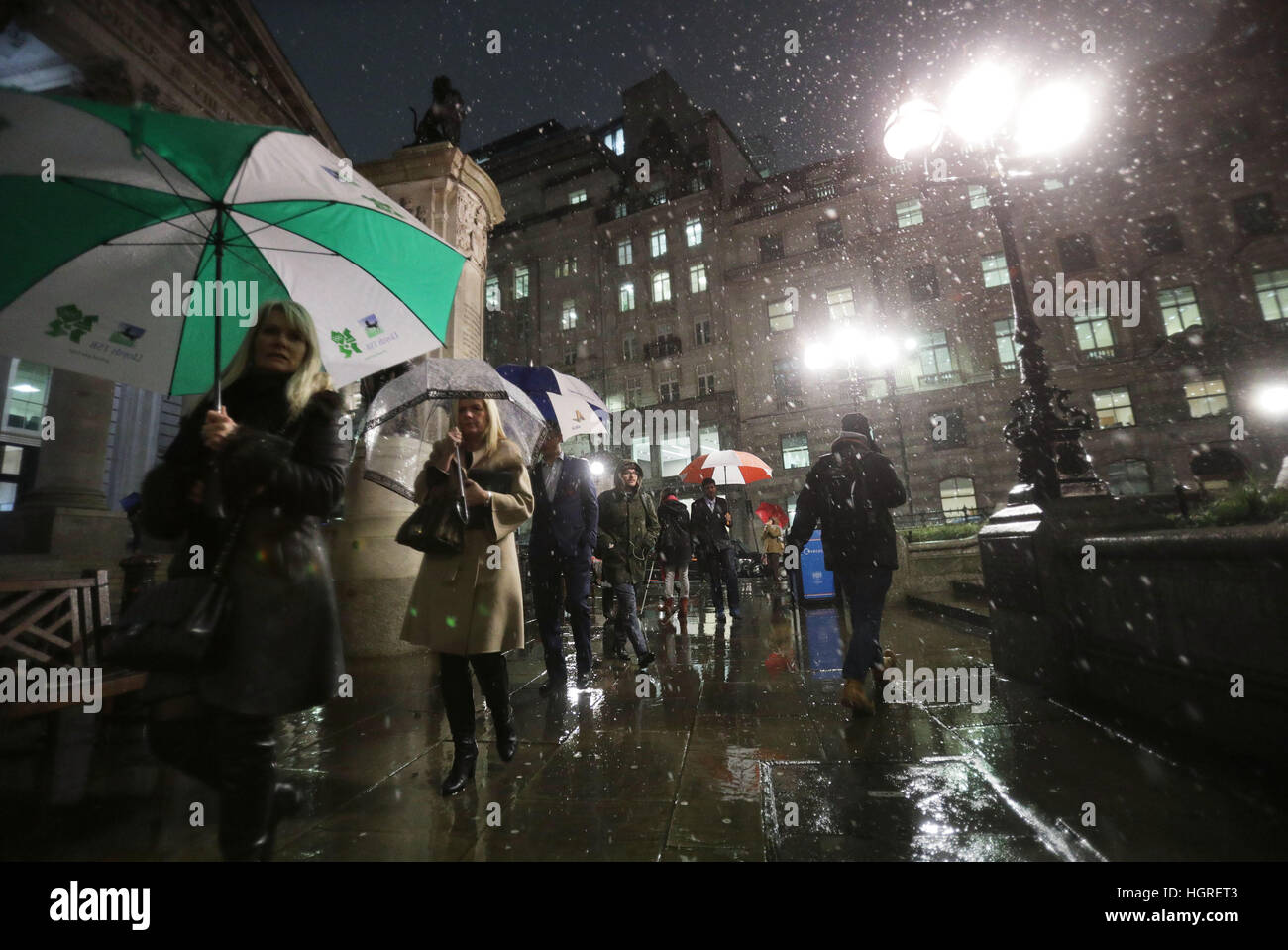 People during a snow flurry at Bank, City of London, as blizzard ...