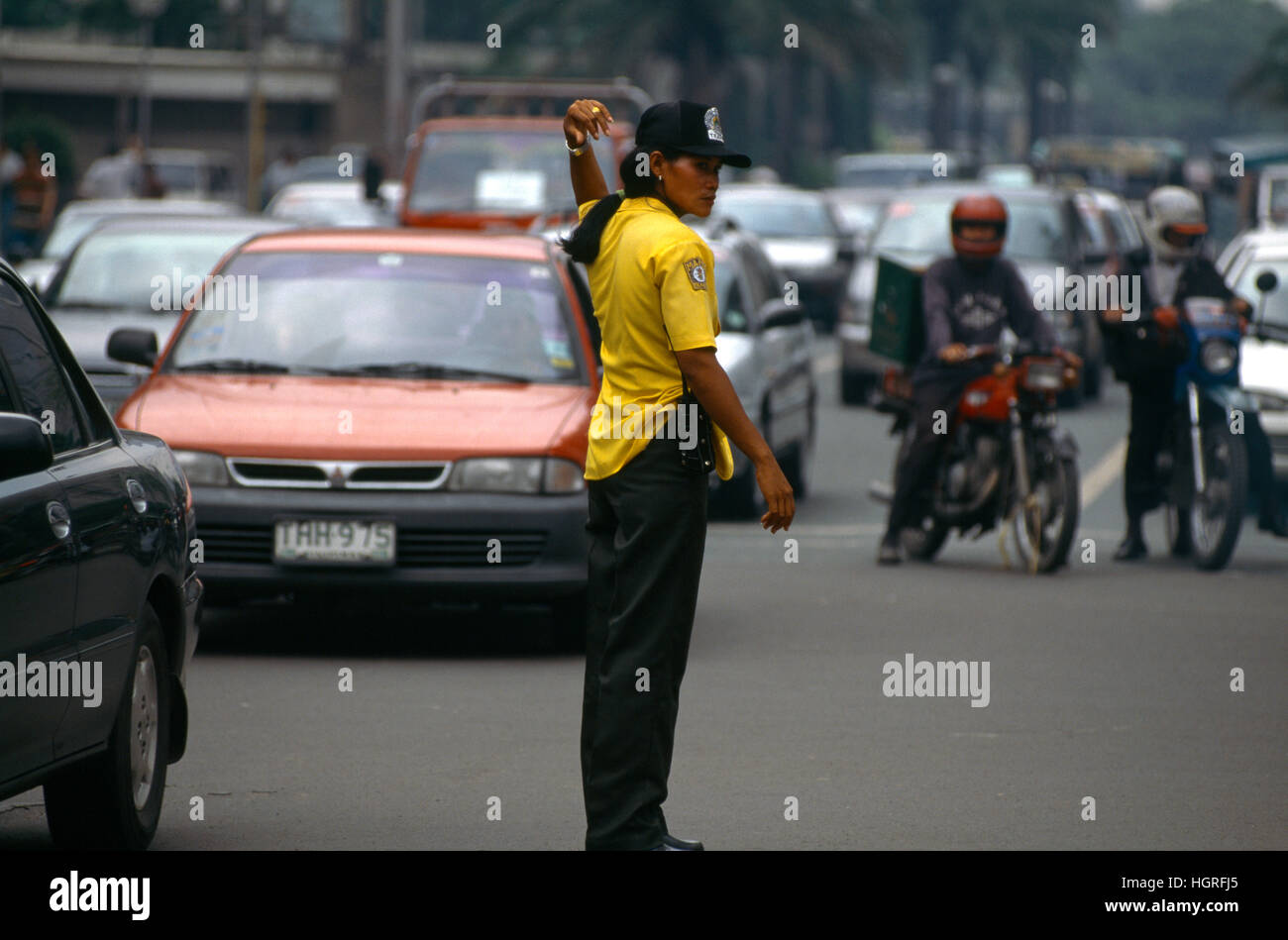 Traffic Police Woman Directing Traffic, Manila, Philippines Stock Photo ...