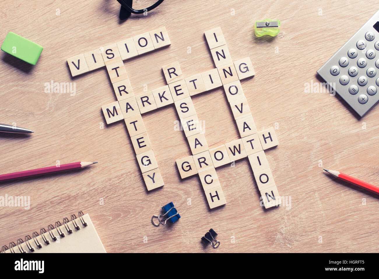 Conceptual business keywords on table with elements of game making ...