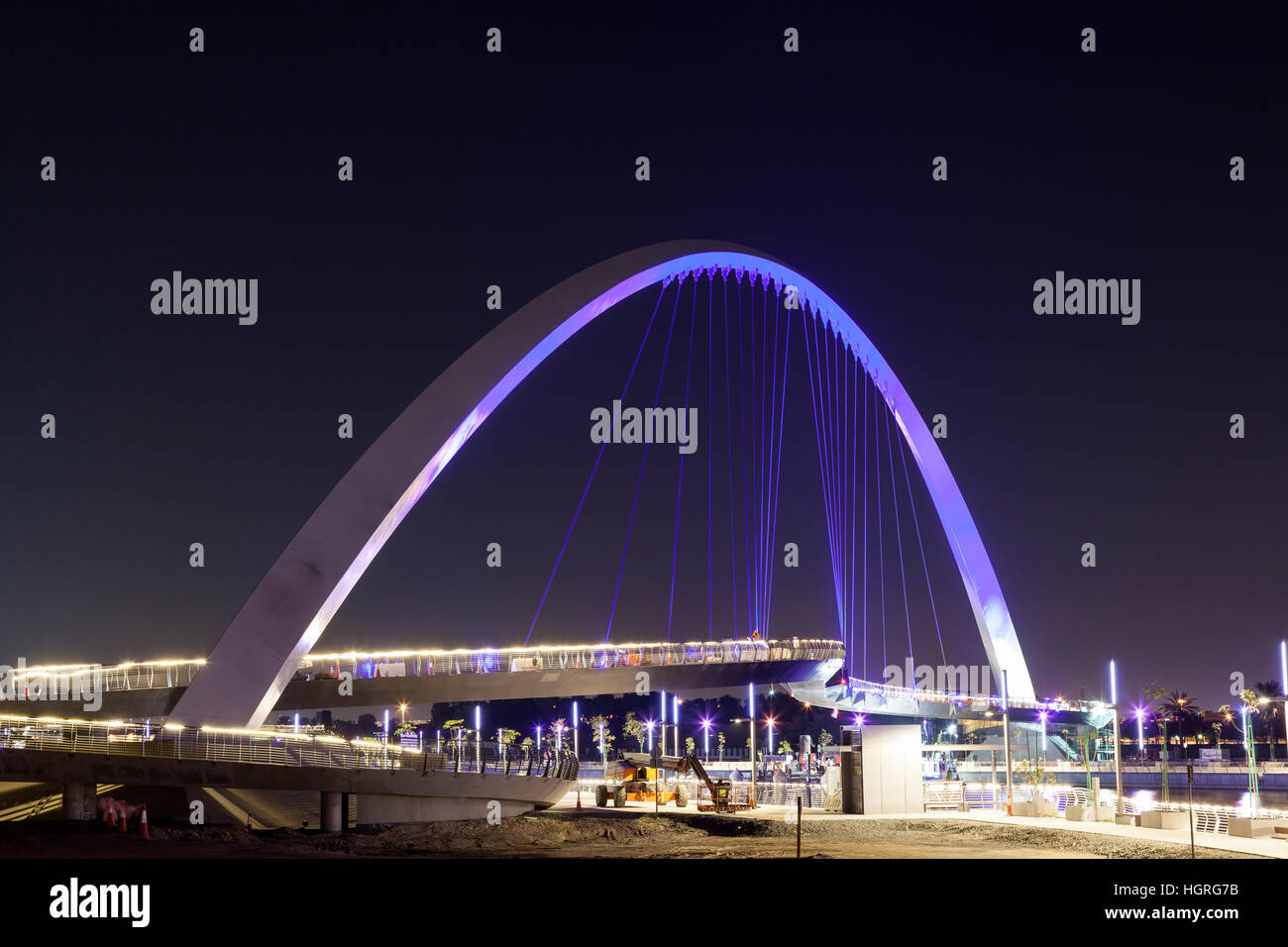 Blue Arch bridge at the Dubai Water Canal at night Stock Photo - Alamy