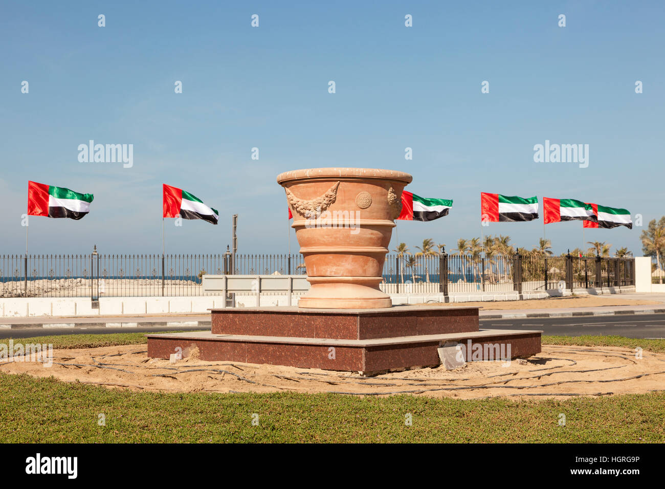 Giant flower pot in a roundabout in the city of Dubai, United Arab ...