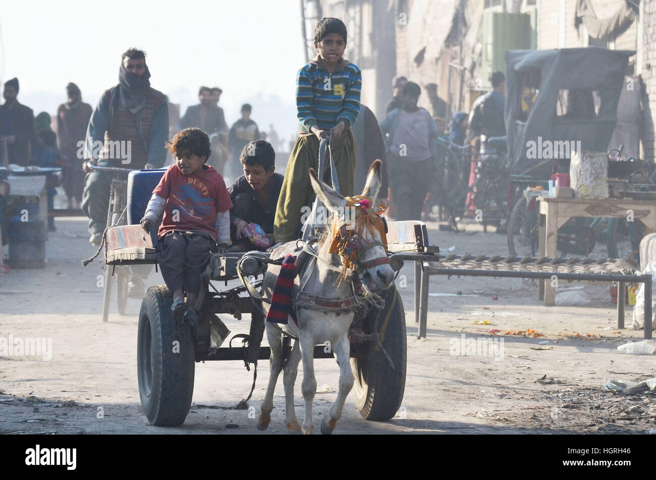 Lahore, Pakistan. 12th Jan, 2017. Pakistani people busy in their ...