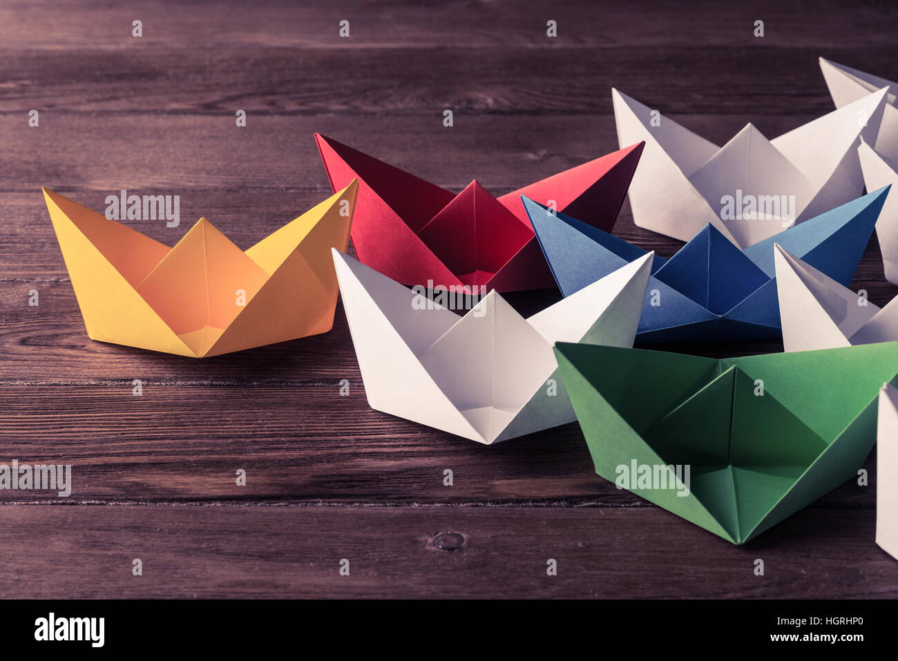 Business leadership concept with white and color paper boats on Stock ...