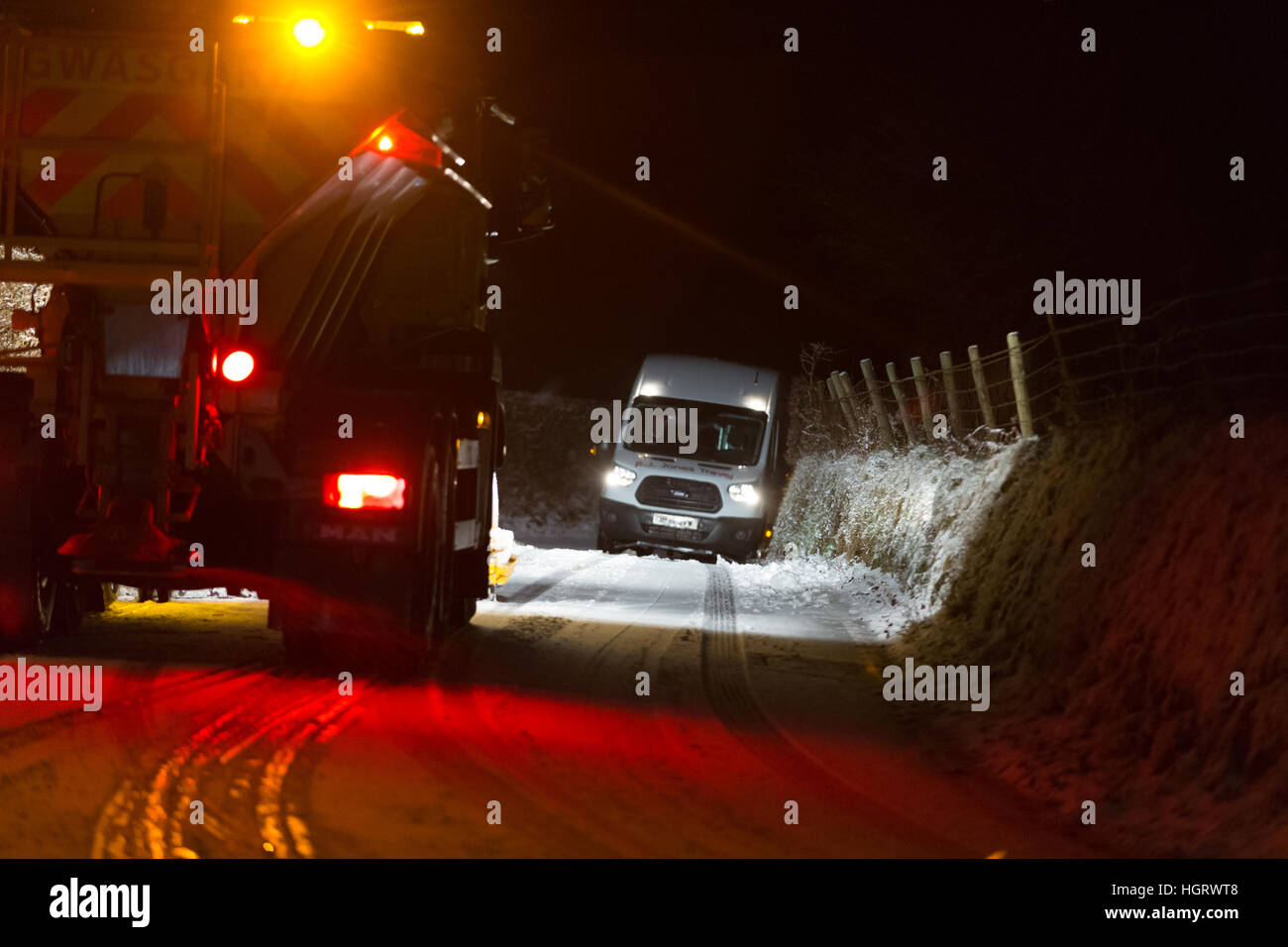A council gritter gritting the roads in ceredigion, Wales. as a van ...